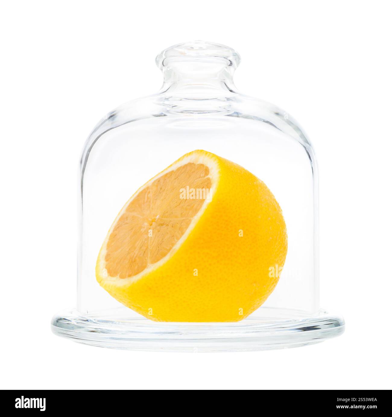 side view of half of yellow lemon in Glass Lemon Keeper isolated on ...