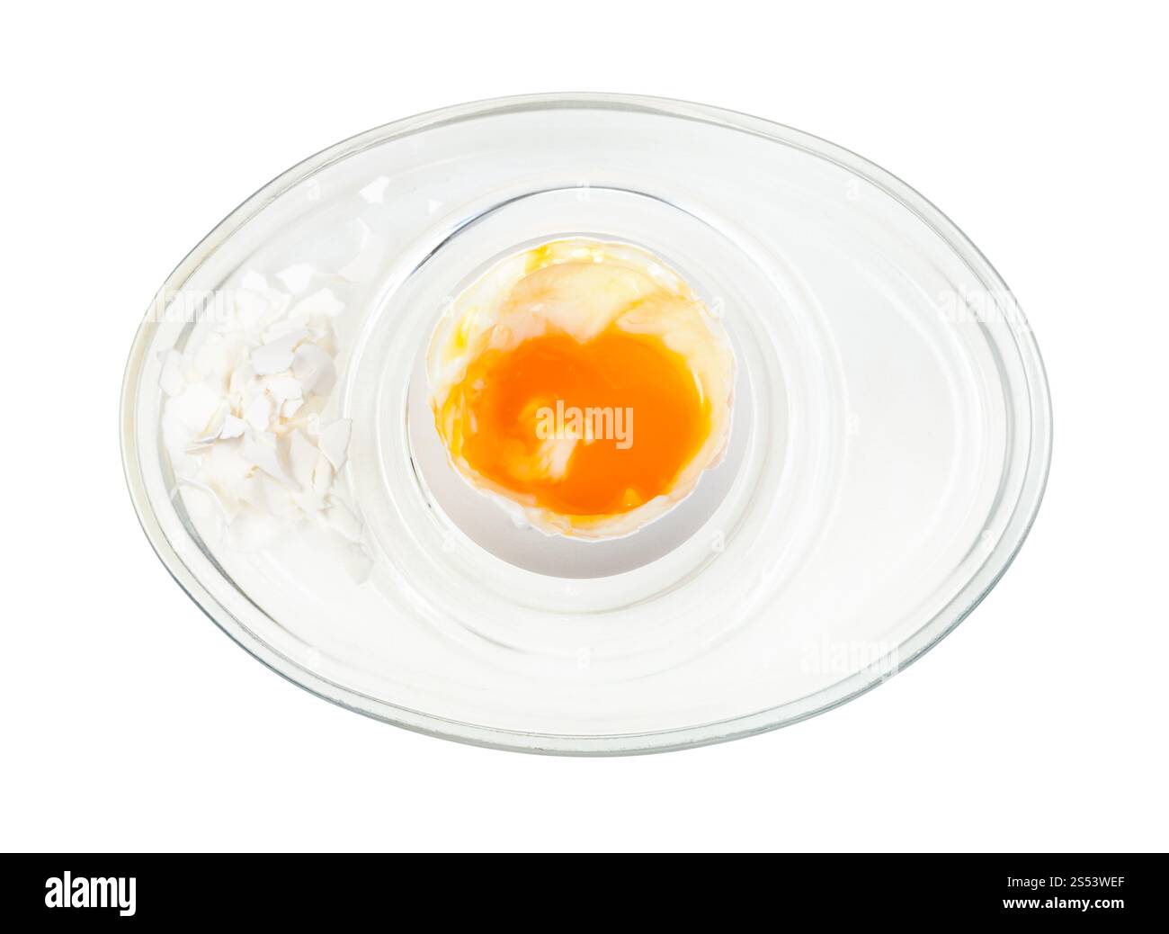 top view of open boiled white egg in glass egg cup isolated on white ...
