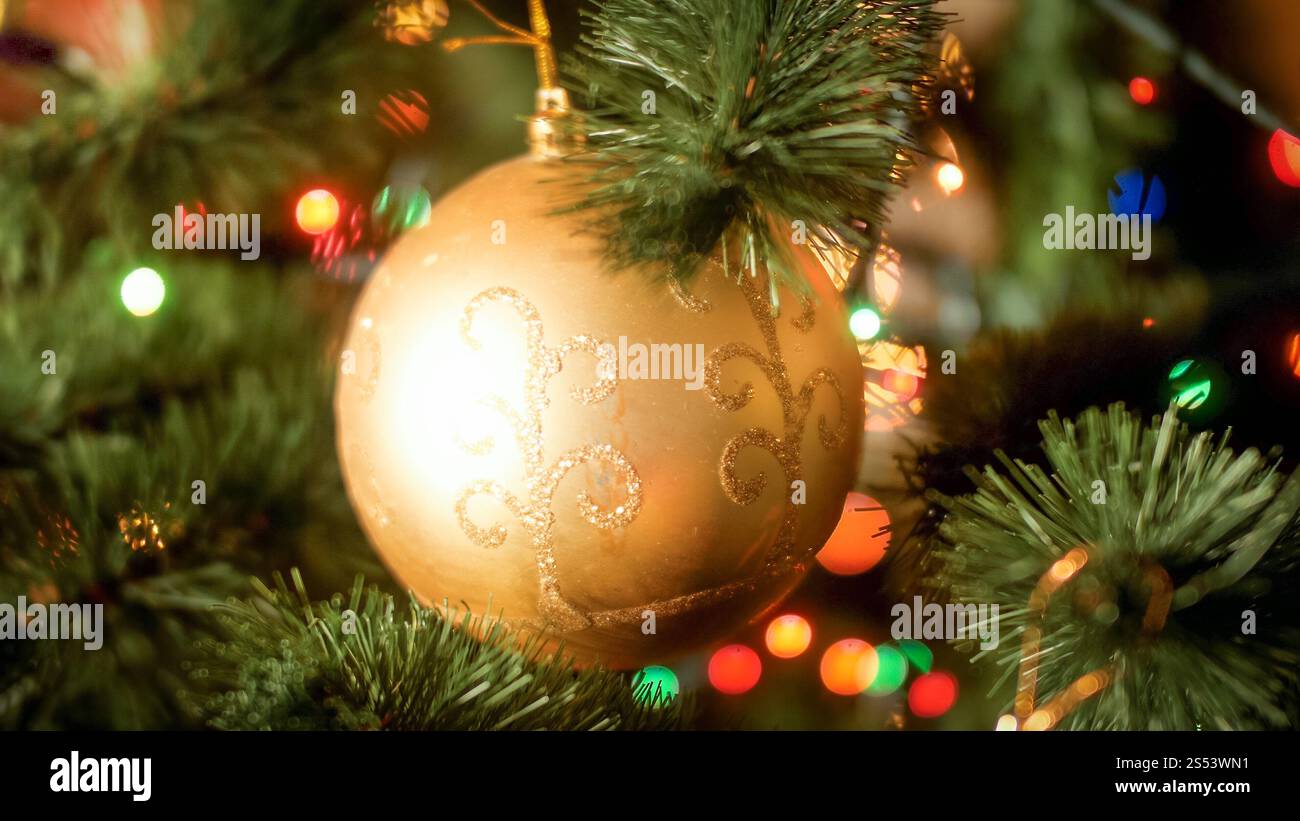 Closeup abstract photo of golden bauble with sparkles hanging on ...