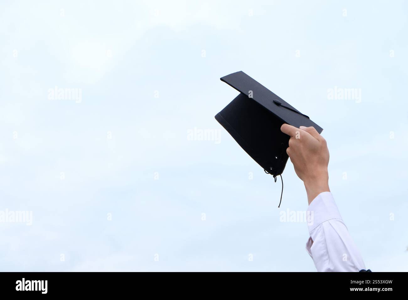 Student with congratulations, graduates wearing a graduation gown of ...
