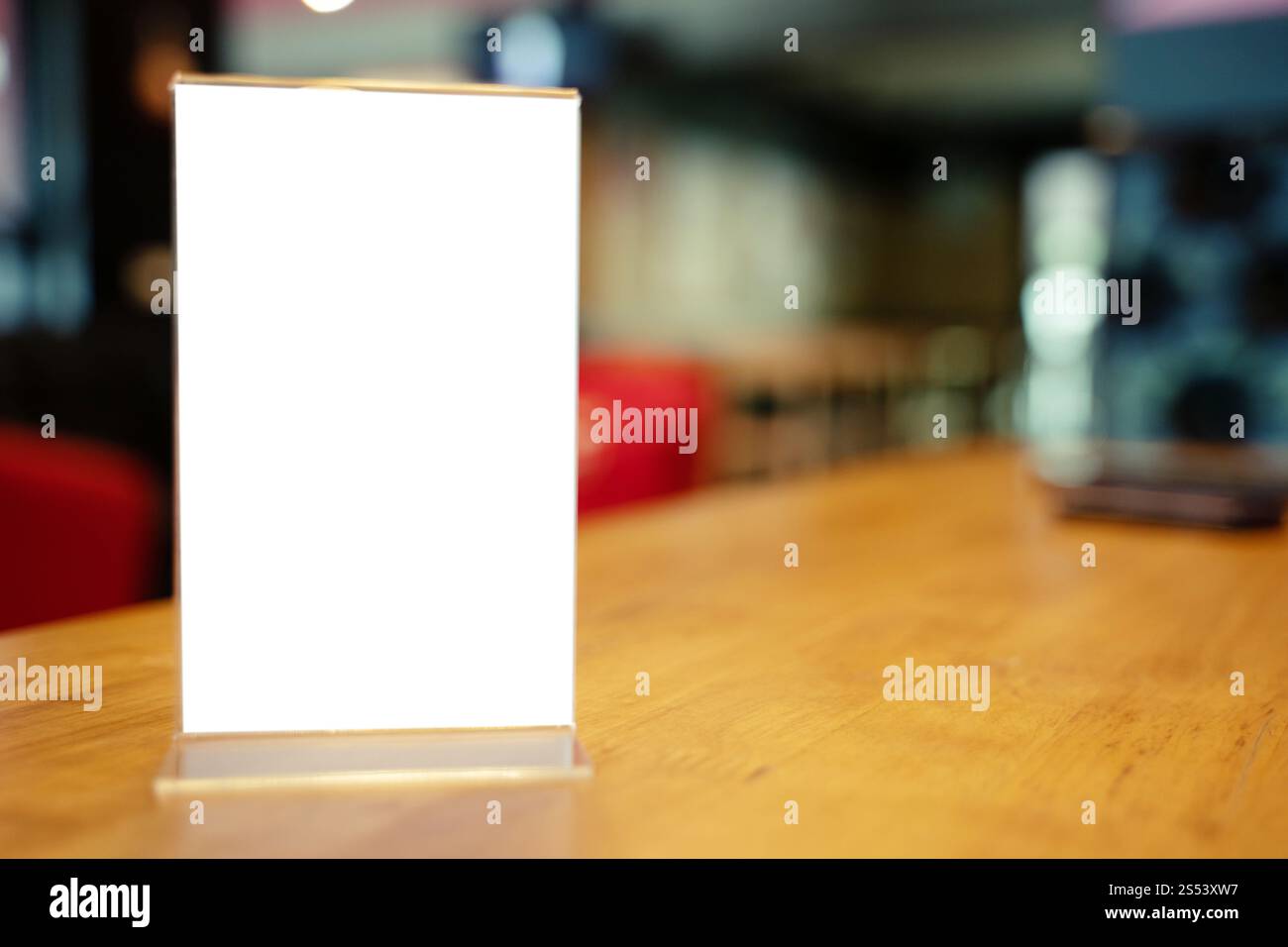 Mock up Menu frame standing on wood table in Bar restaurant cafe. space ...