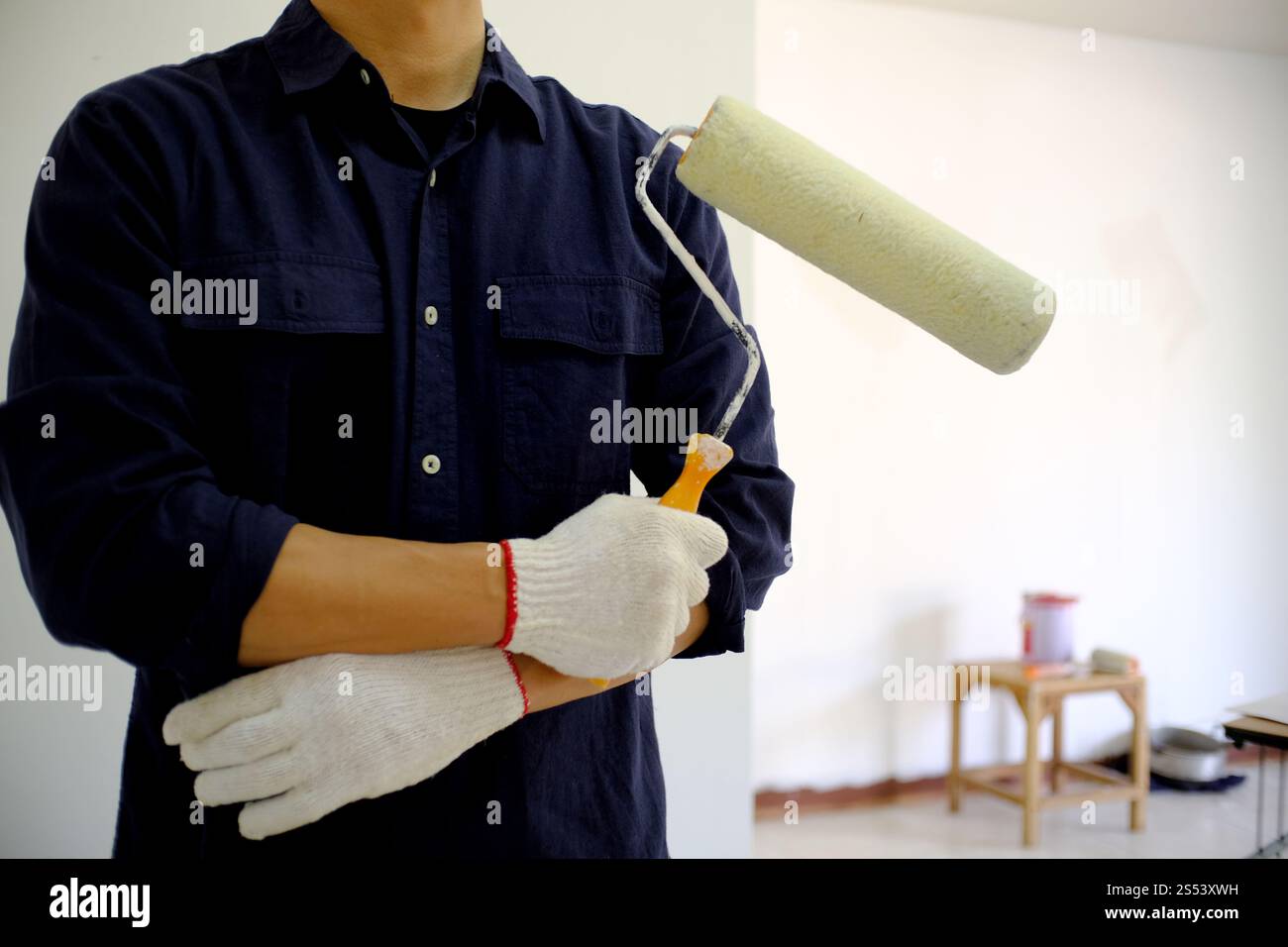 Room Painting Job painter man with roller Stock Photo - Alamy