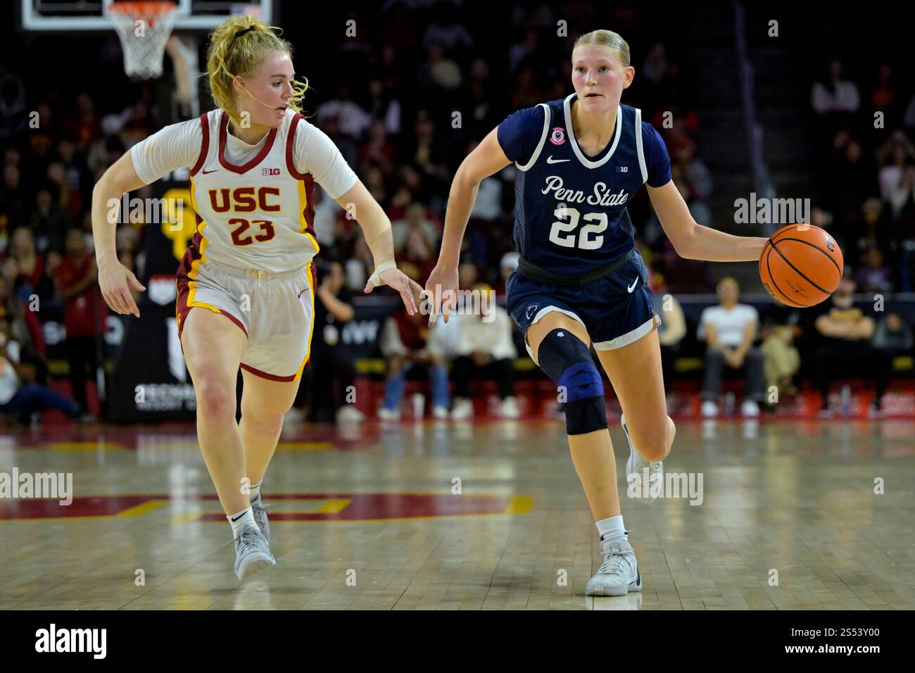 Southern California guard Avery Howell, left, defends Penn State guard ...