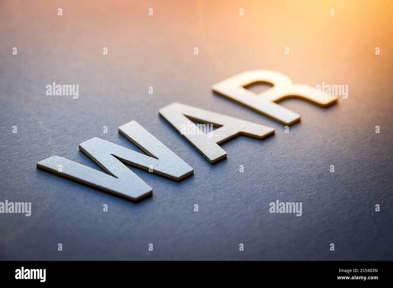 Word war written with white solid letters on a board. Word war written ...