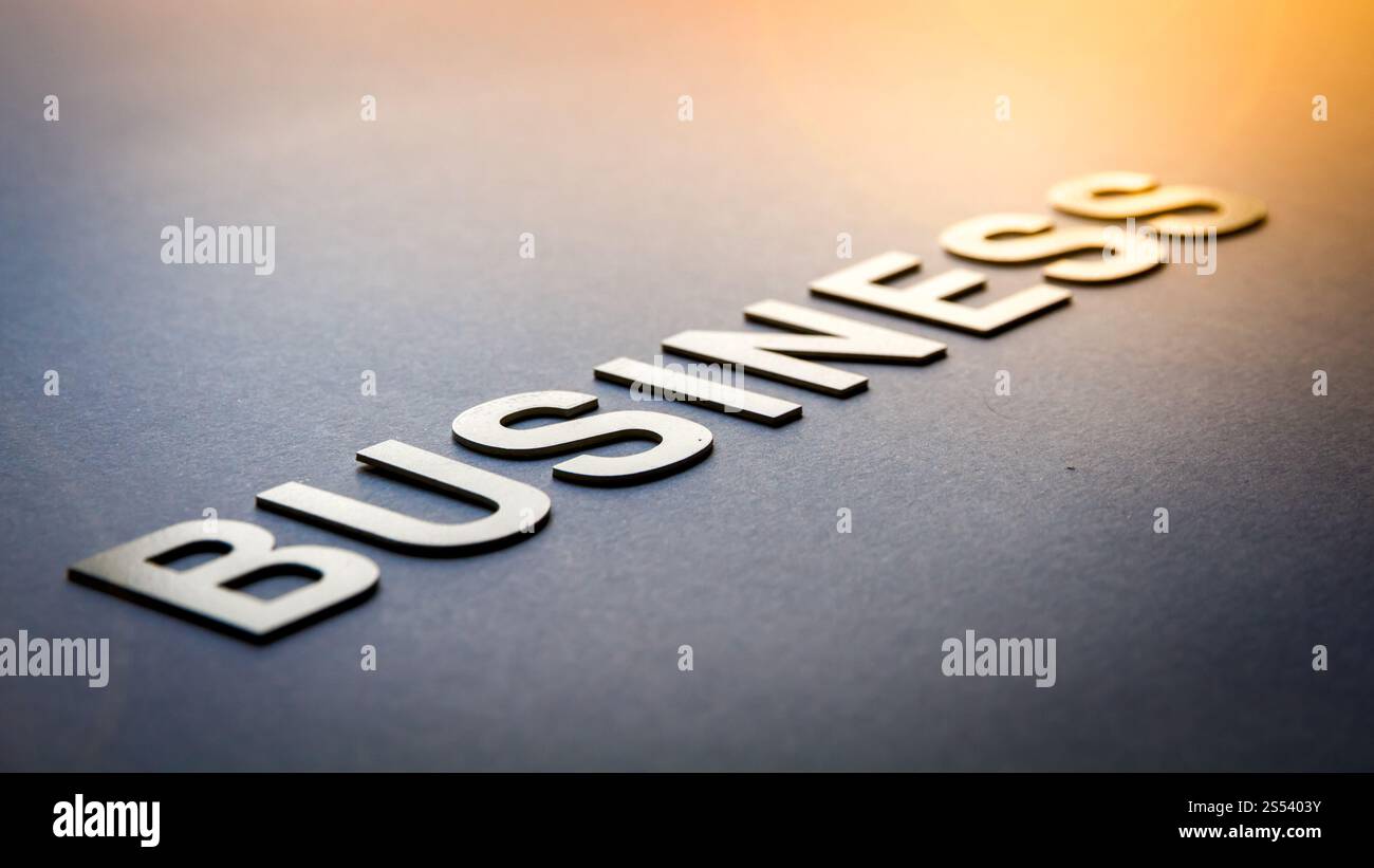 Word business written with white solid letters on a board. Word ...