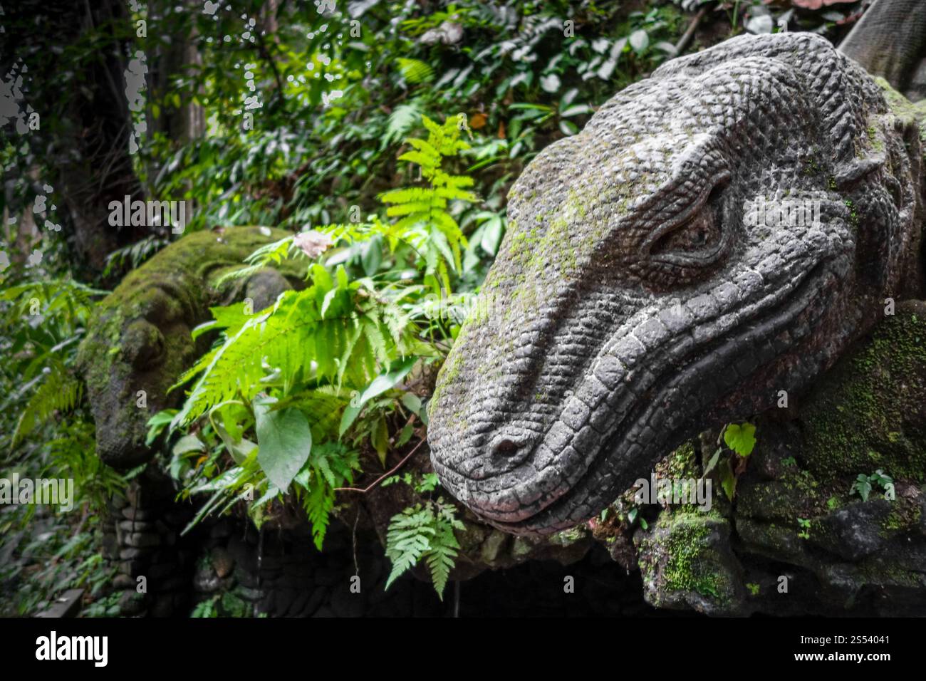 Old lizard statue in the sacred Monkey Forest, Ubud, Bali, Indonesia ...