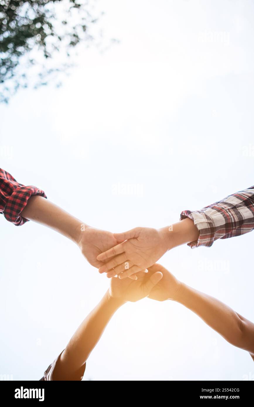 Education people teamwork join hands together Stock Photo - Alamy