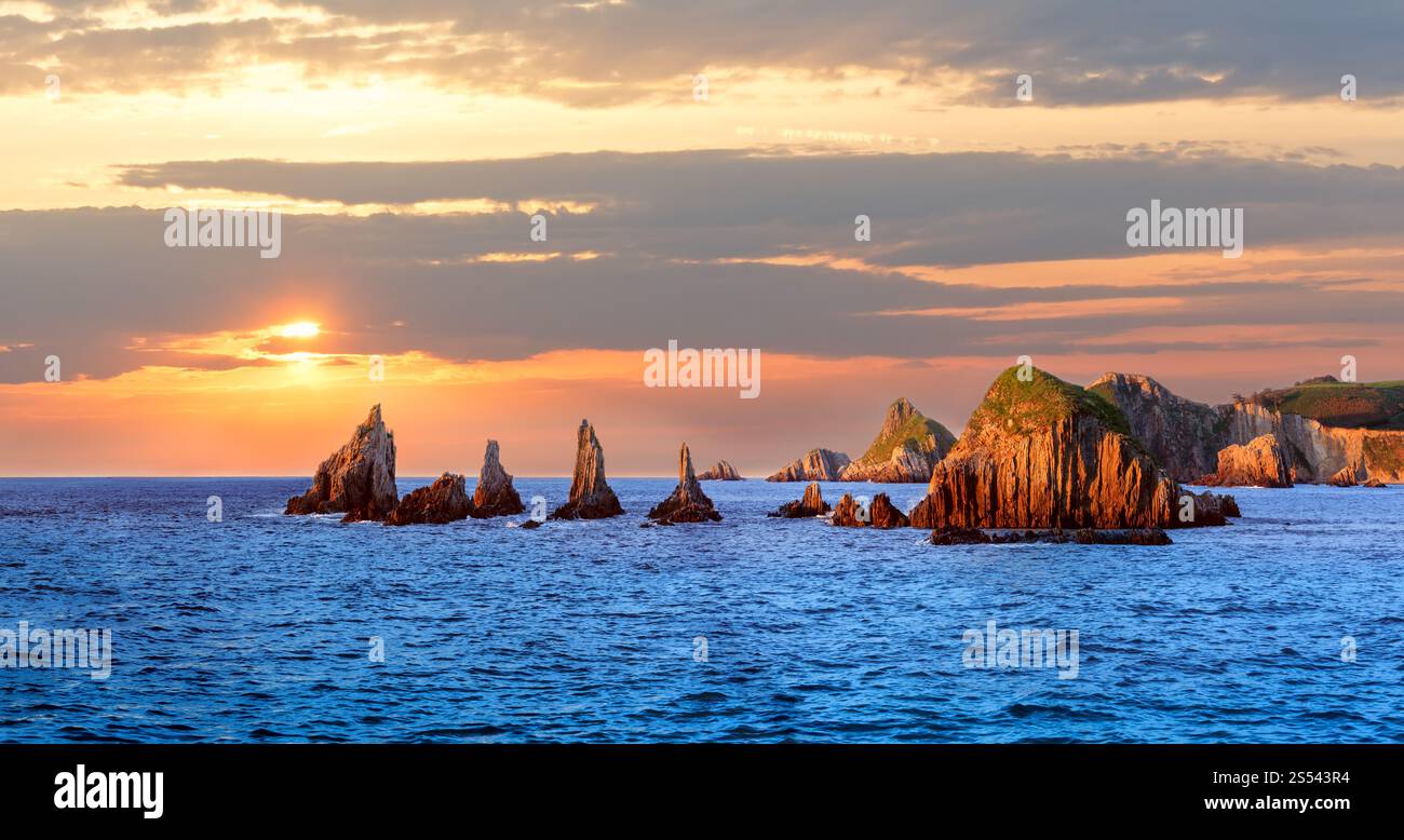 Sharp islets near Gueirua beach, Asturias, Spain. Sunset evening ...
