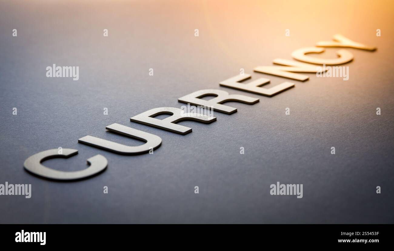 Word currency written with white solid letters on a board. Word ...