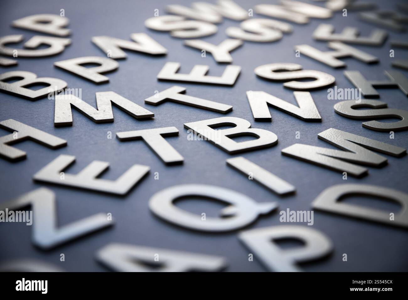 Mixed solid letters pile closeup photo. Education background concept ...