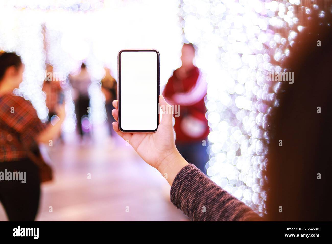Womens hands holding cell telephone watching social media in a smart ...