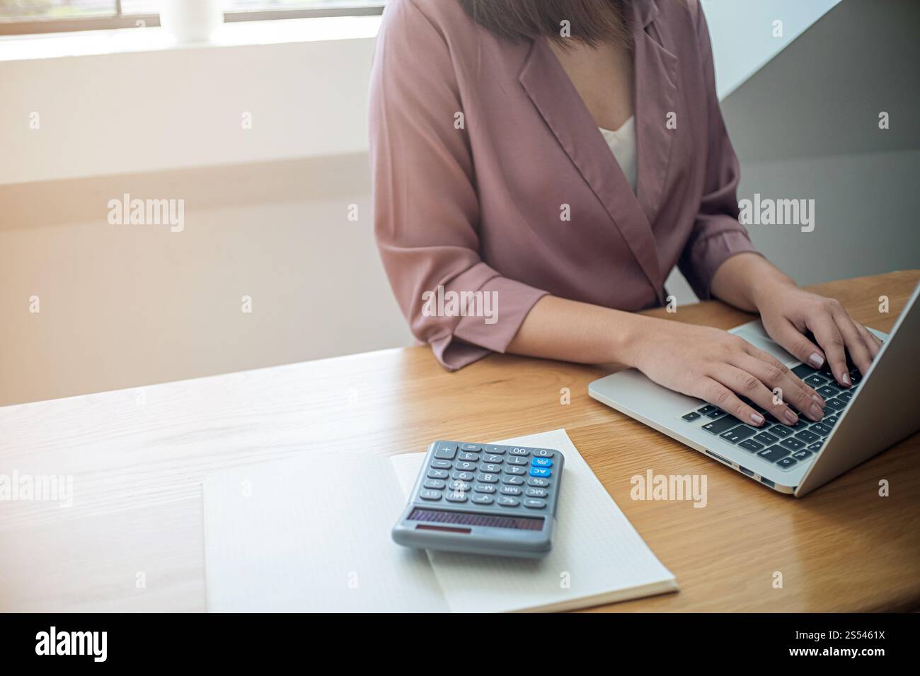 Business women checking bills. taxes bank account balance and ...