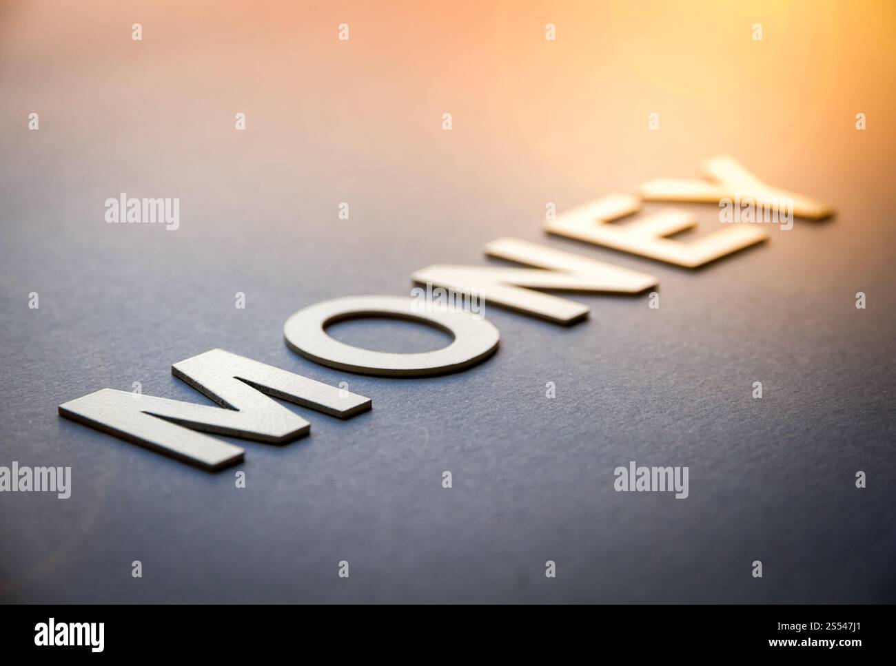 Word money written with white solid letters on a board. Word money ...