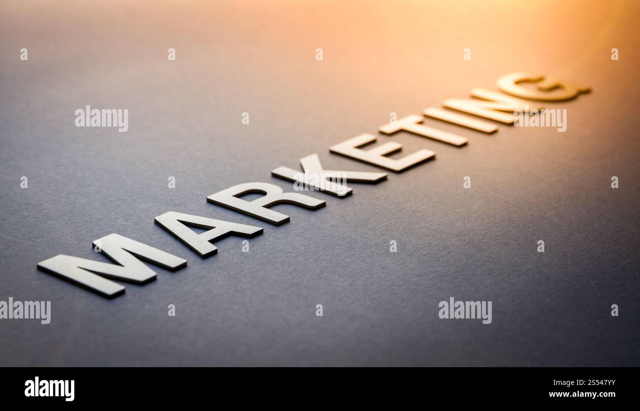 Word marketing written with white solid letters on a board. Word ...