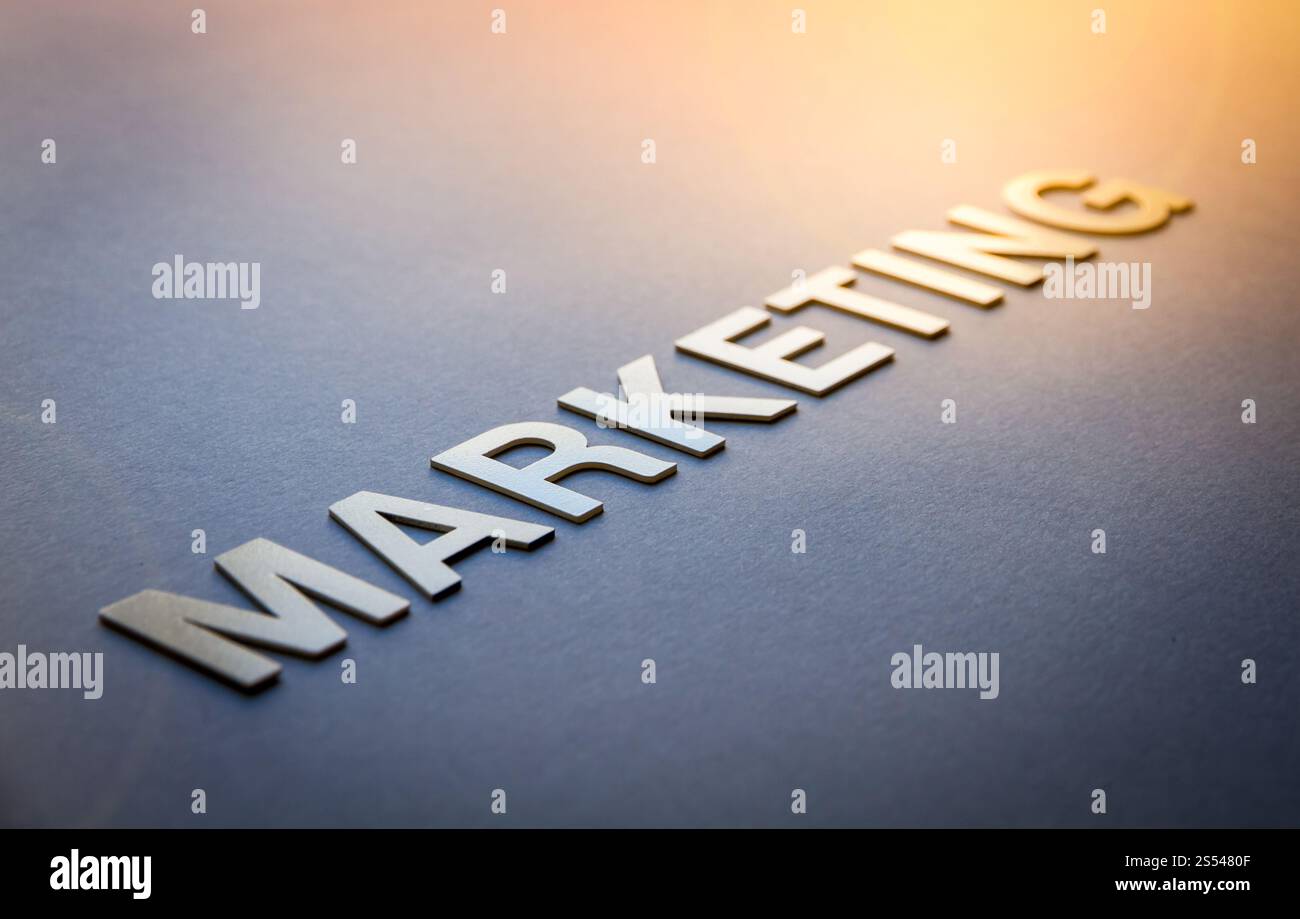 Word marketing written with white solid letters on a board. Word ...