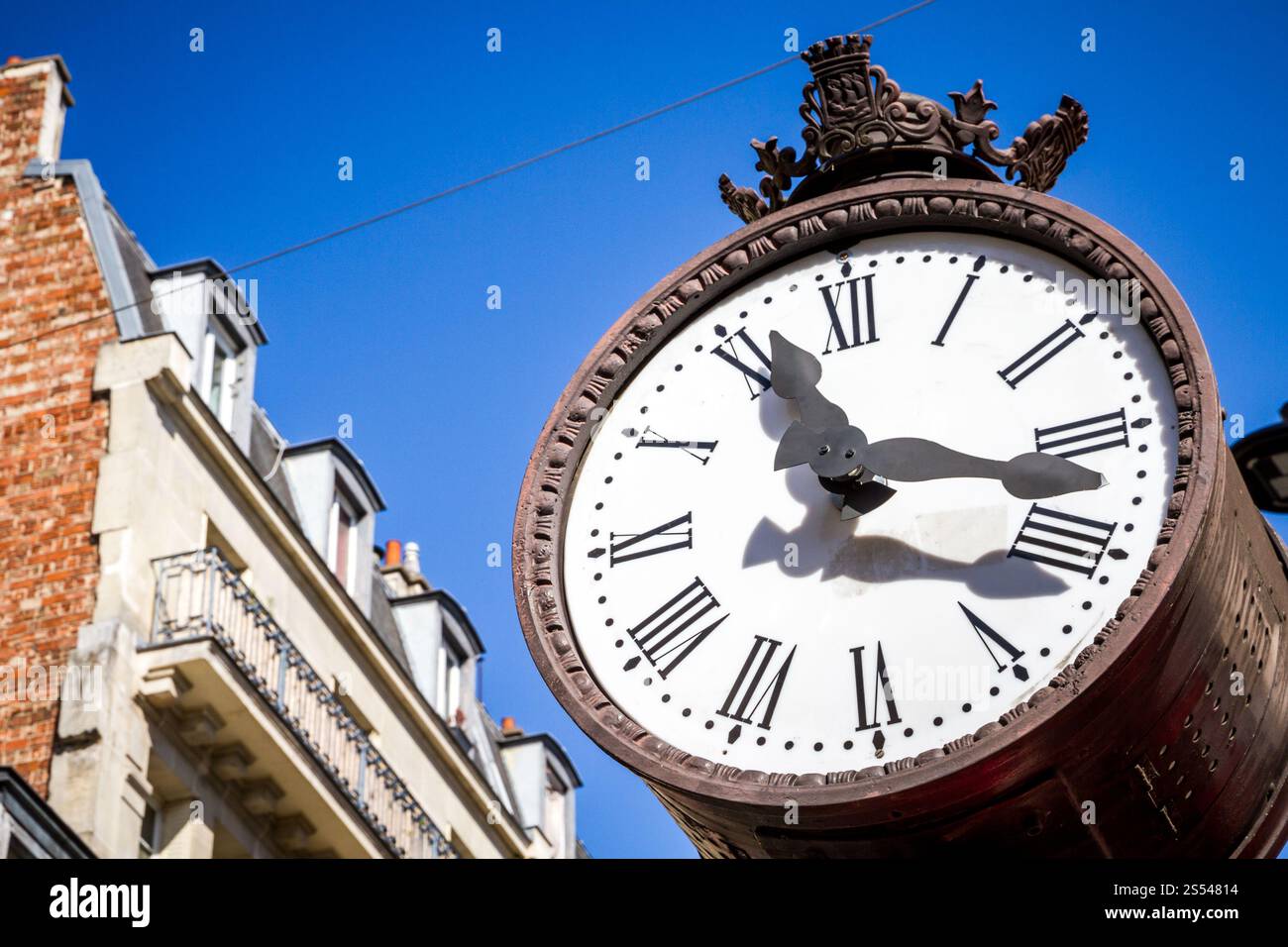 Traditional public clock detail in paris hi-res stock photography and ...
