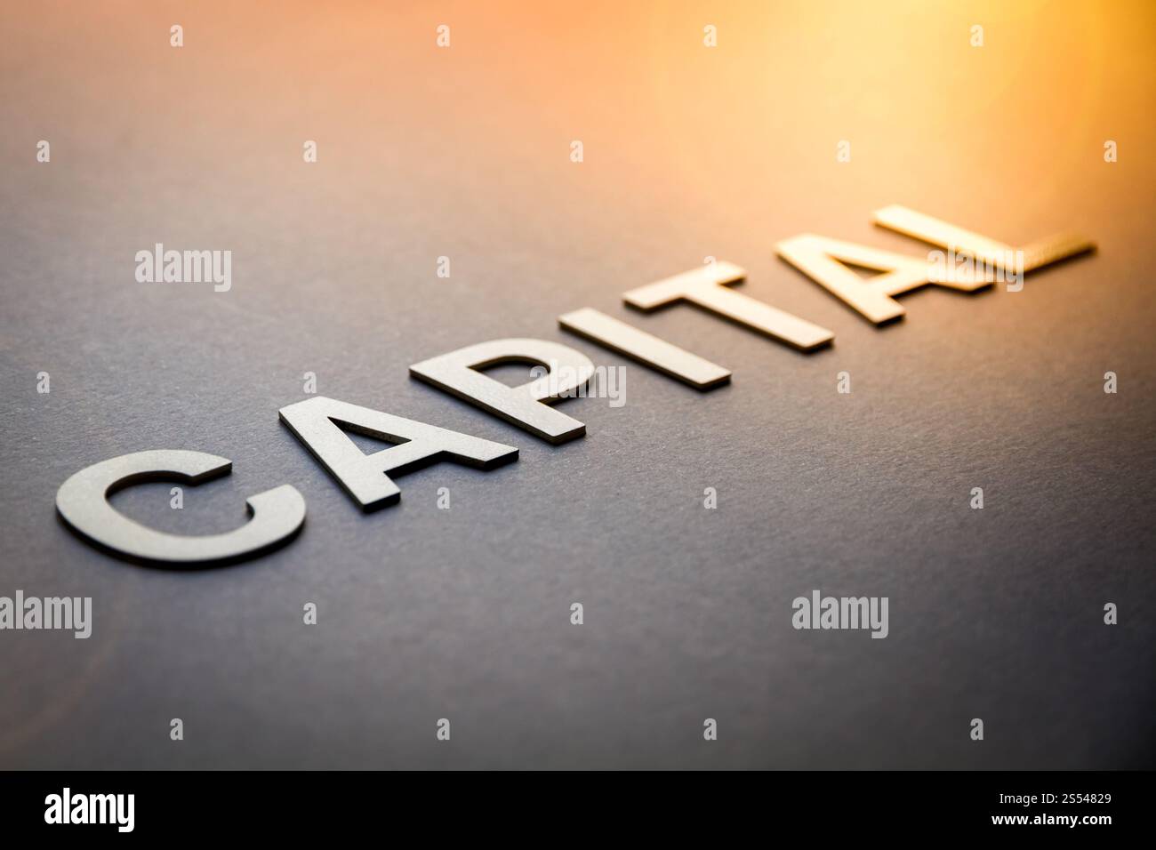 Word capital written with white solid letters on a board. Word capital ...