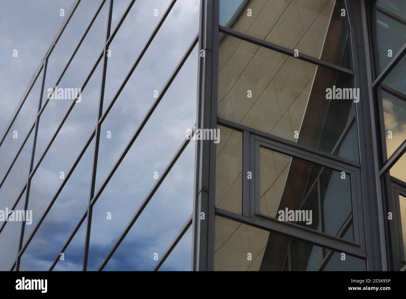 Close-up of the business center window panes. Reflection of an overcast ...