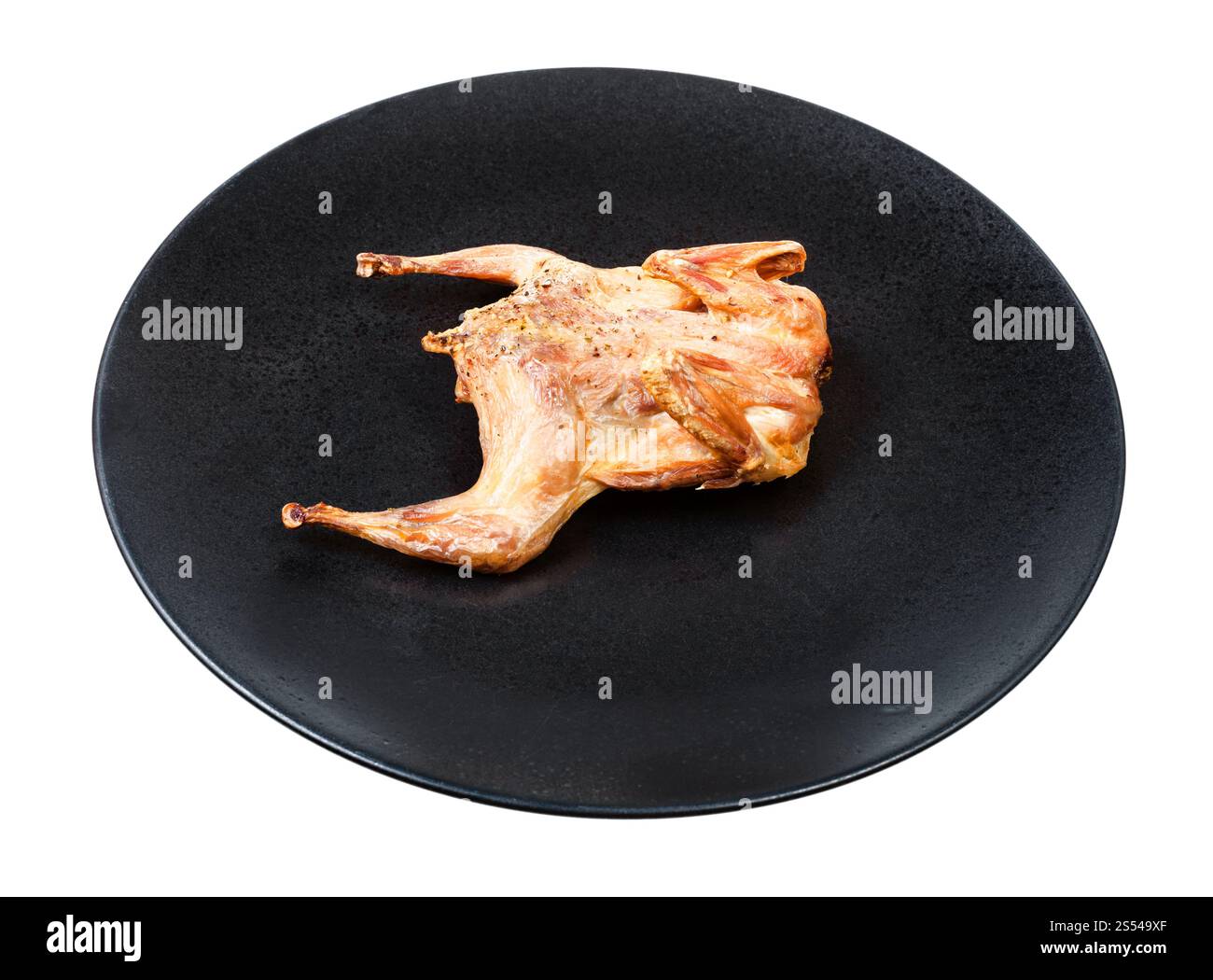 roasted whole flattened quail on black plate isolated on white ...