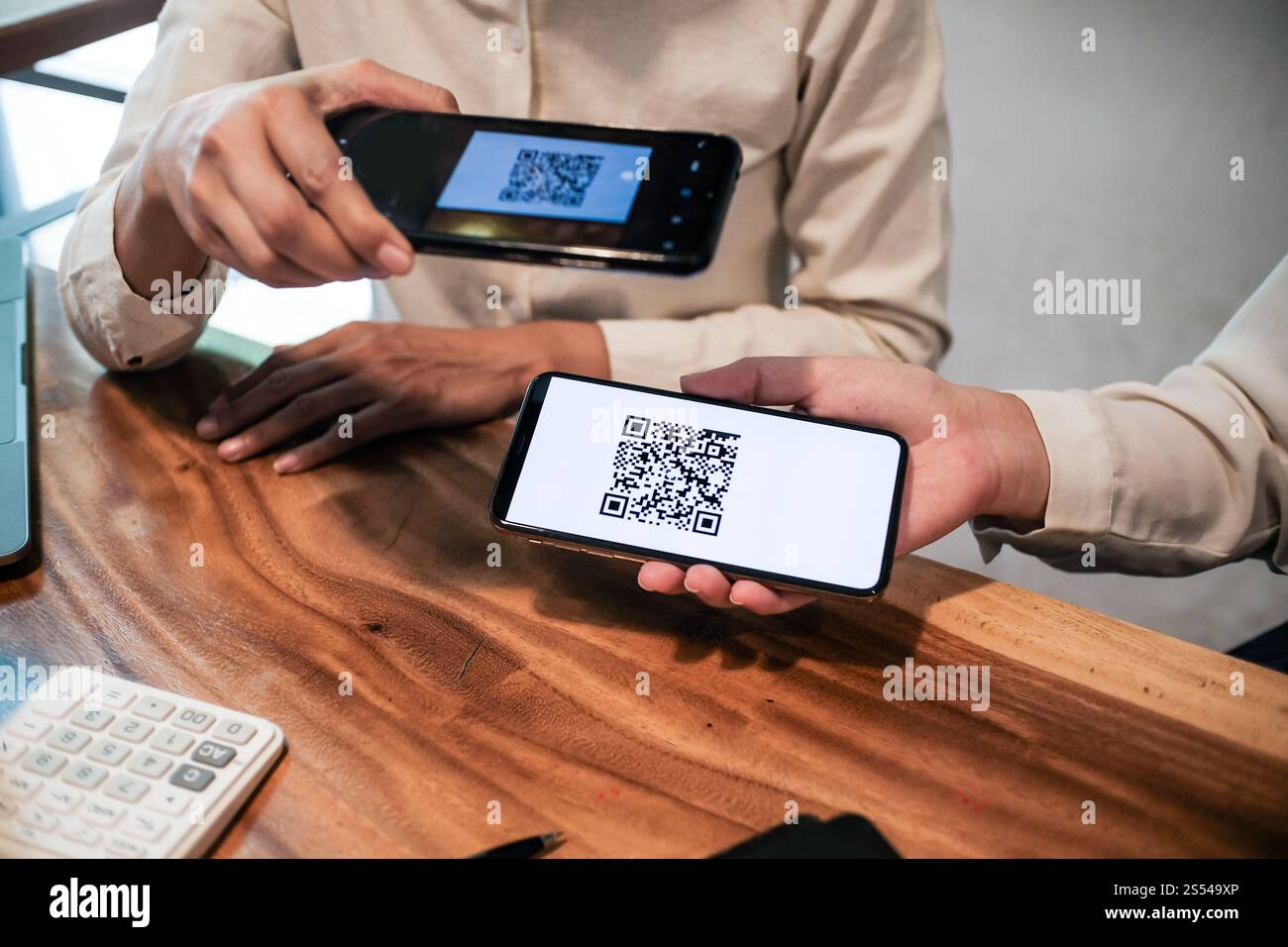 Qr code payment. Woman scanning QR code online shopping cashless ...