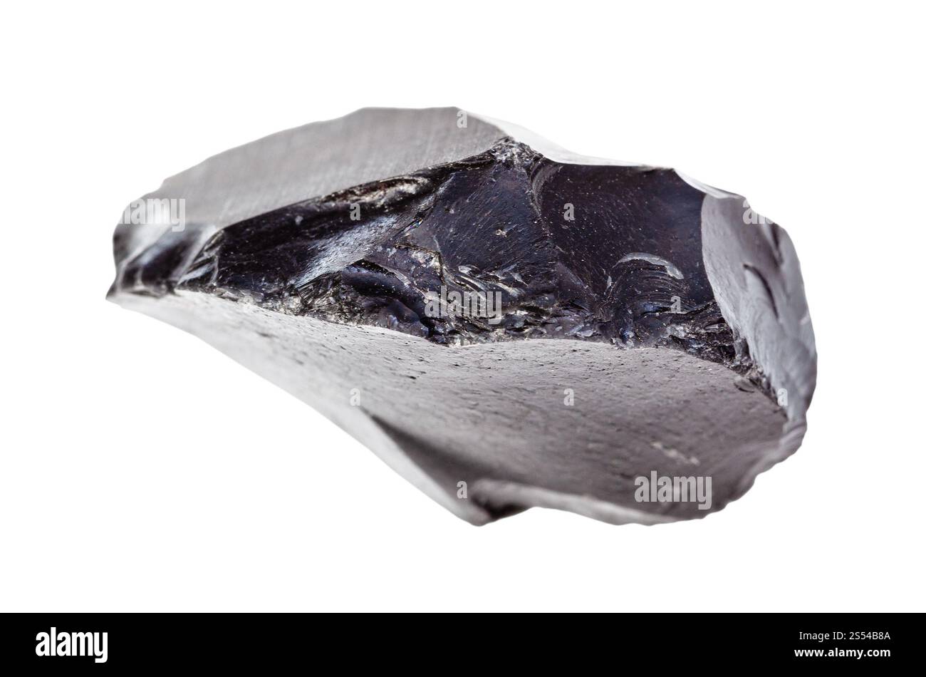 closeup of sample of natural mineral from geological collection - raw Obsidian (volcanic glass ...