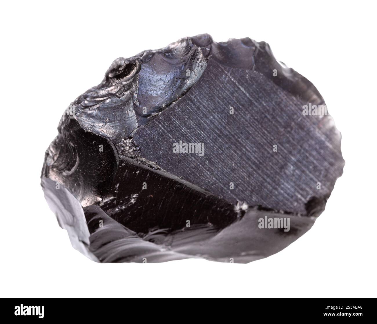 closeup of sample of natural mineral from geological collection - rough Obsidian (volcanic glass ...