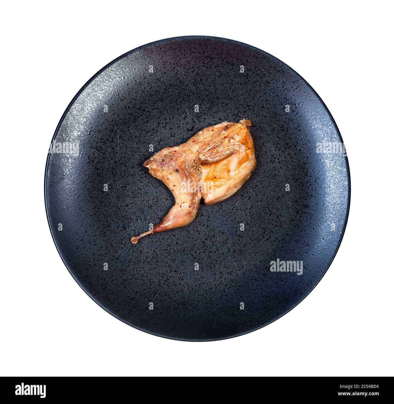 top view of half of fried quail on black plate isolated on white ...