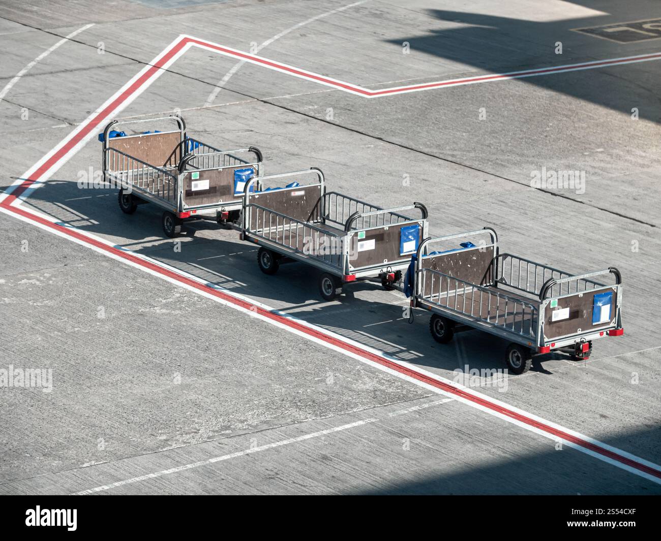 Photo of three gound service empty carts for carrying and loading ...