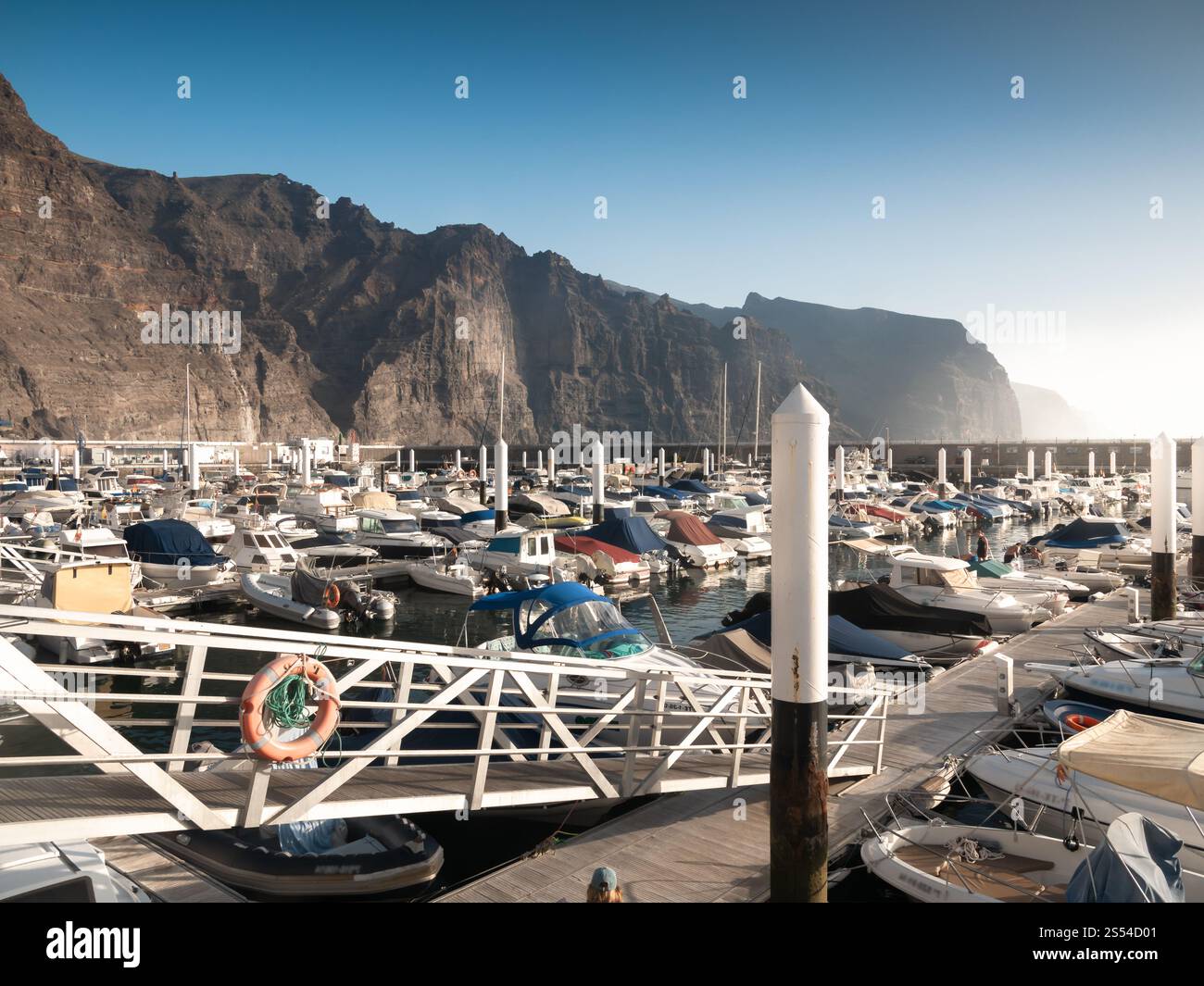 Toned image of big harbour with moored motor boats and yachts in the ...