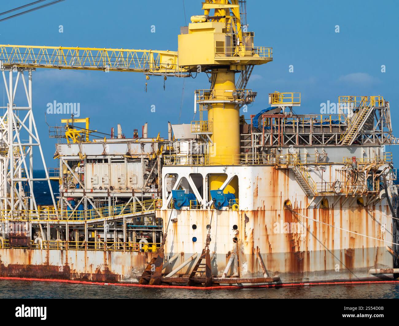 Photo of big heavy crane working on floating platform at cargo port ...
