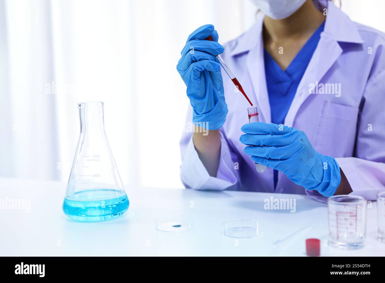 Scientist holding Coronavirus covid-19 infected blood sample tube. DNA ...