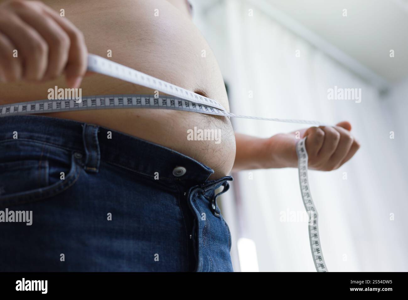 Man with fat belly in dieting concept. Overweight man touching his fat ...