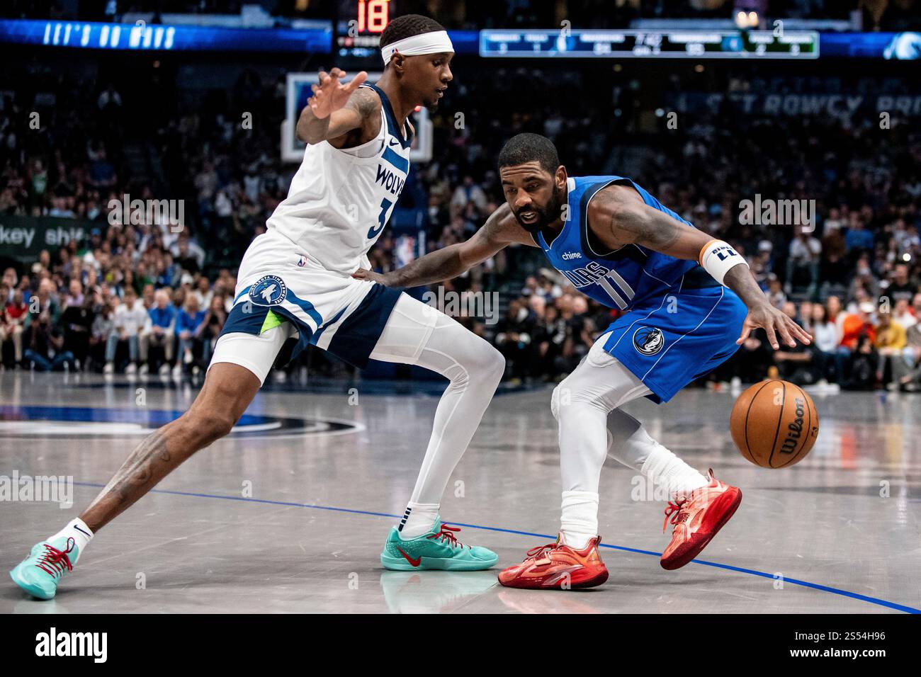 Dallas Mavericks guard Kyrie Irving (11) keeps his dribble as Minnesota ...