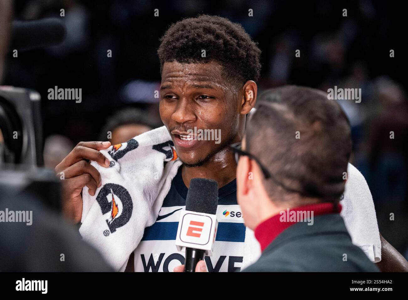 Minnesota Timberwolves guard Anthony Edwards (5) answers questions from ...