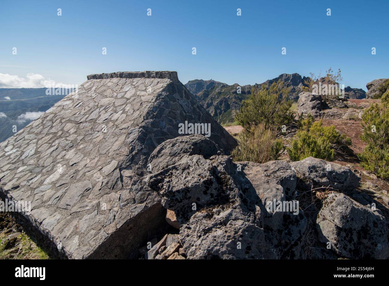 a stone house on a peak in the Landscape and Mountains of the Madeira ...