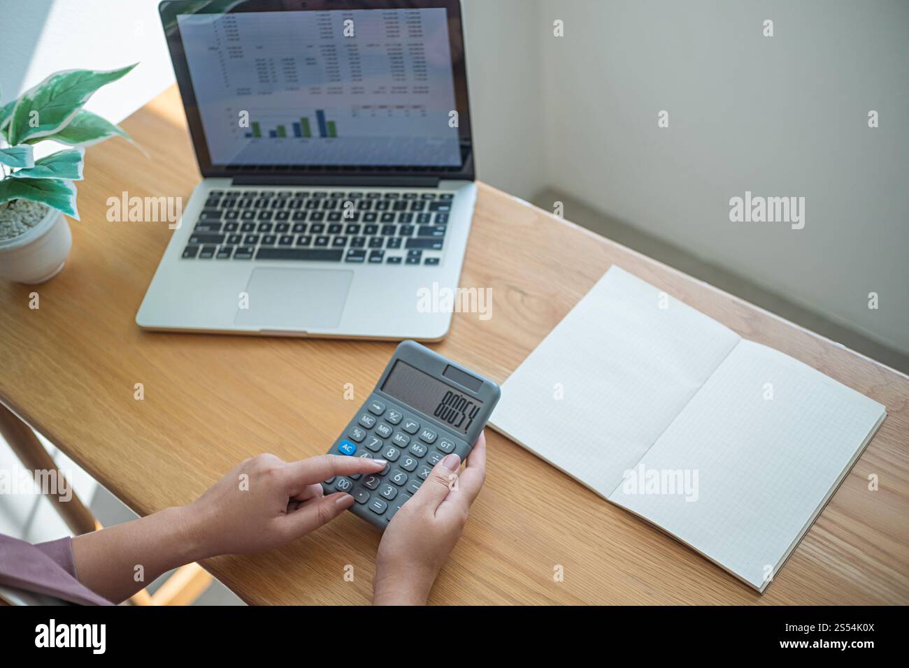 Business women checking bills. taxes bank account balance and ...