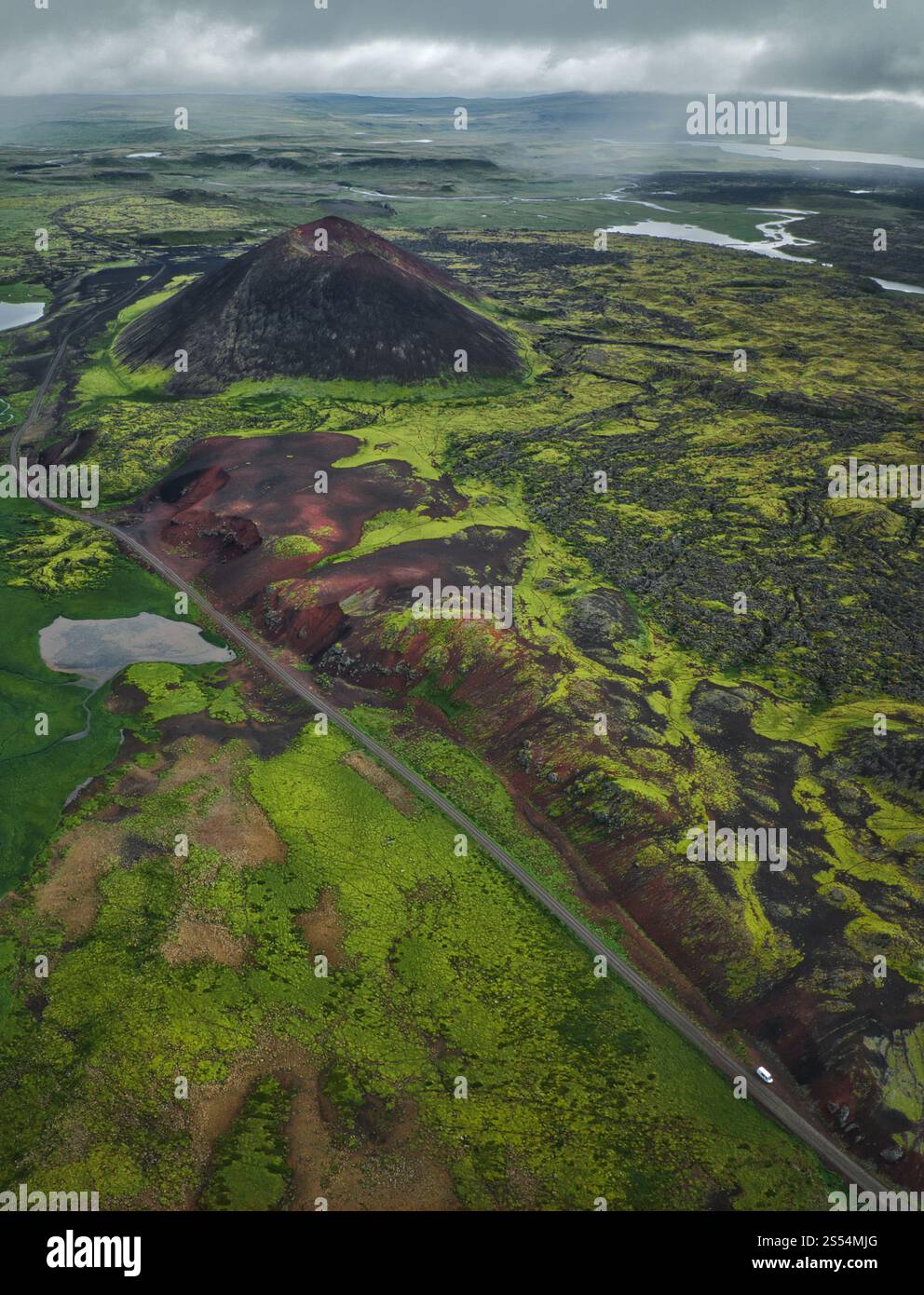 Aerial view of Icelandic volcanic terrain, featuring moss-covered lava ...