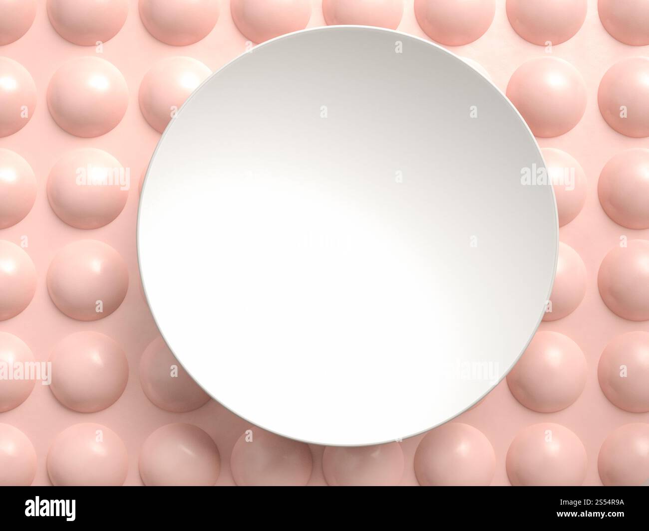 White blank round plate or frame over pink balls and spheres on pink ...