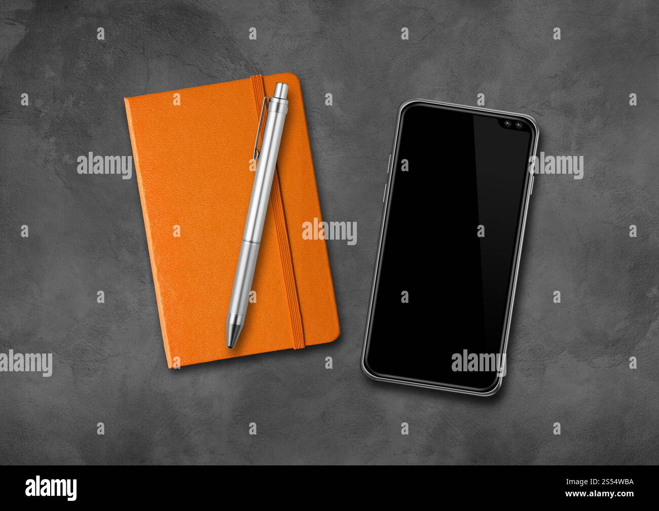 Closed orange notebook, pen and smartphone on a concrete desk. Notebook ...
