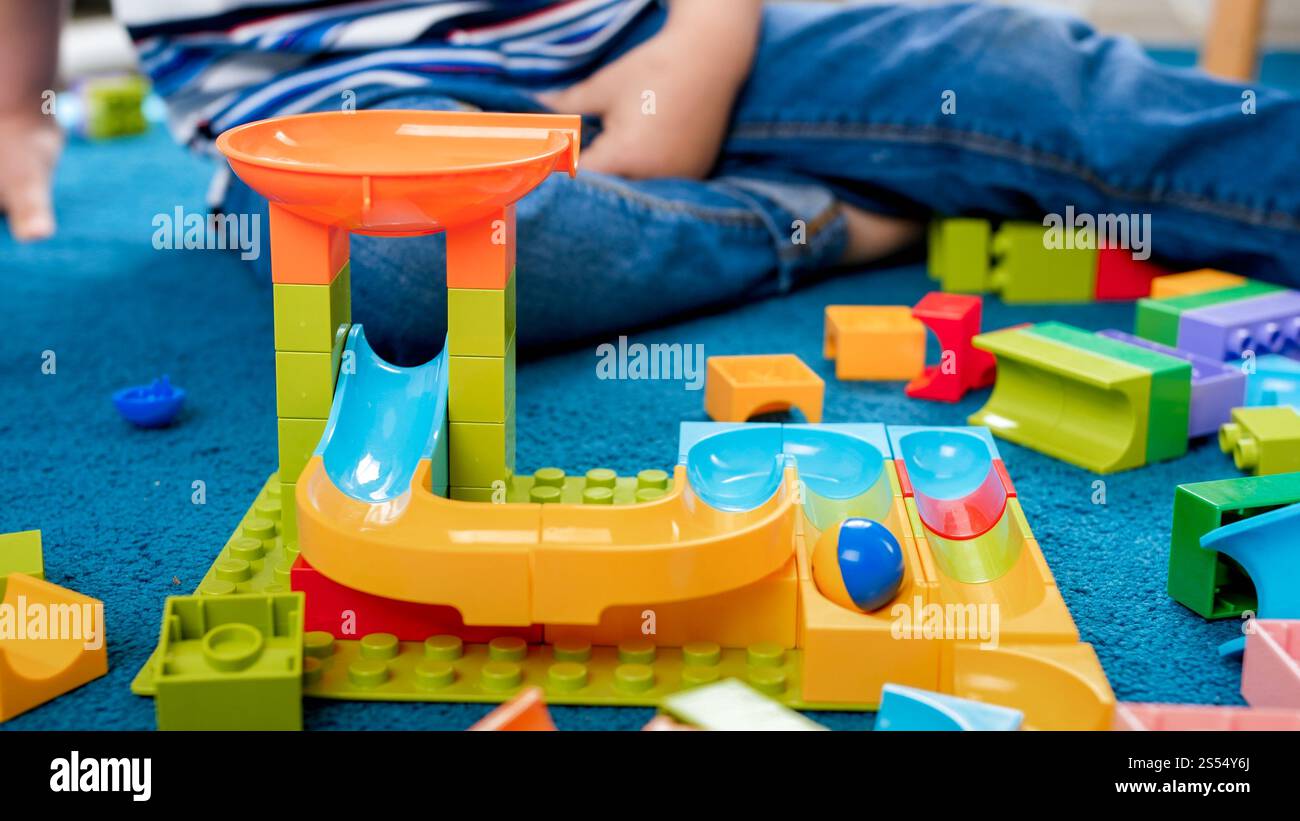 Closeup image of colorful track for marble run in playroom Stock Photo ...