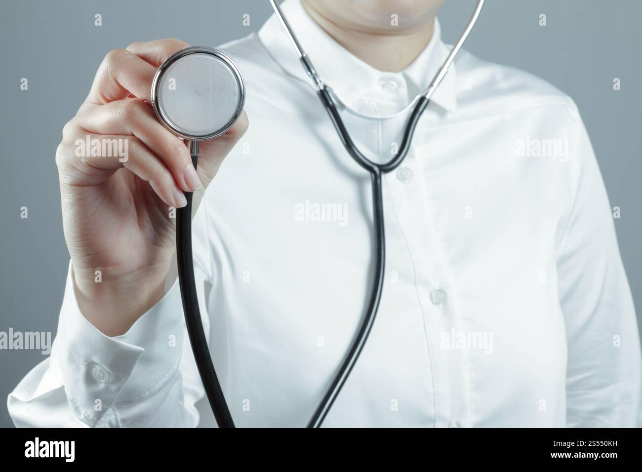 Doctor hand with a stethoscope and human sign social Stock Photo - Alamy