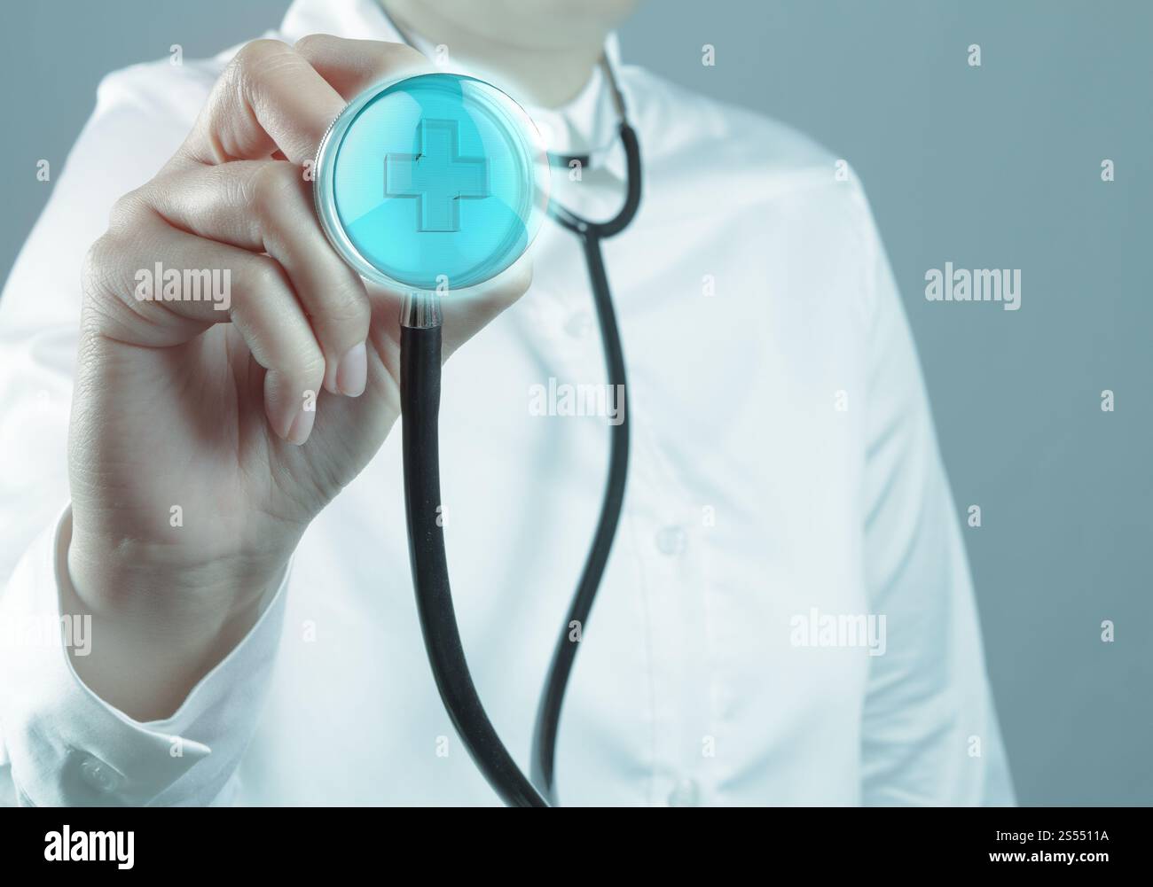 Doctor hand with a stethoscope and human sign social Stock Photo - Alamy
