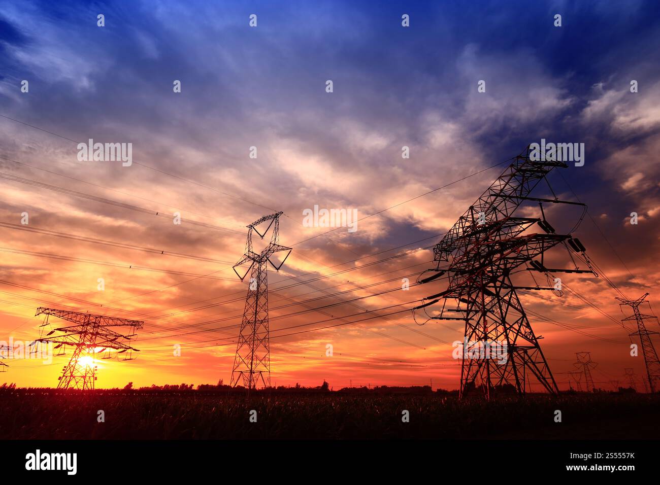 Pylon, high-voltage tower sky background Stock Photo - Alamy
