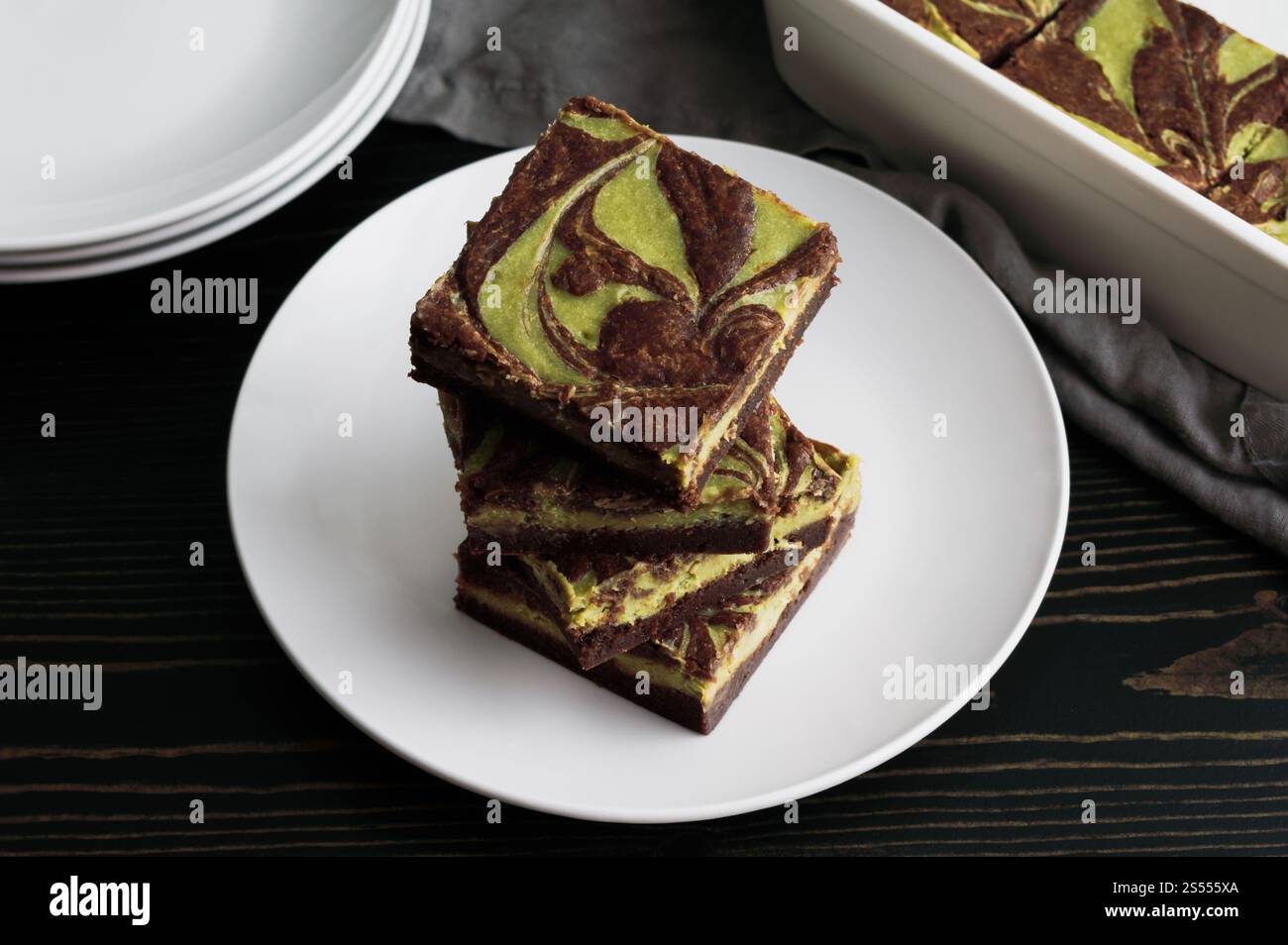 Stacked Matcha Cheesecake Brownies Angled View: Dark chocolate brownies ...