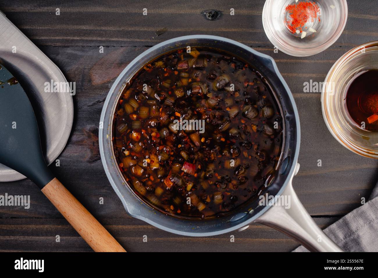 Cooking Shallot Chili Oil in a Small Saucepan: Hot and spicy sauce made ...