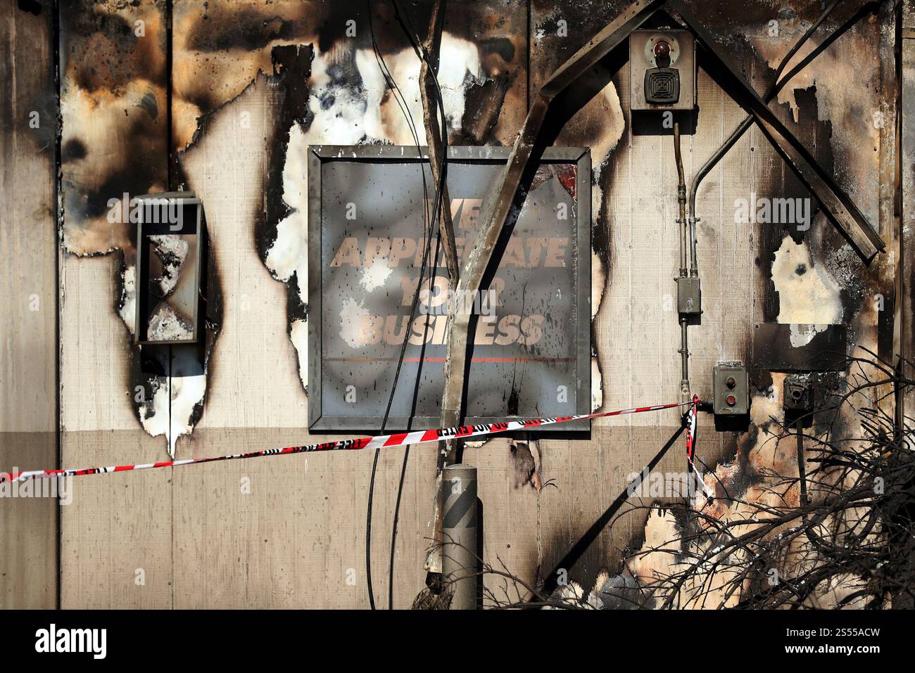 Charred exterior of a Chevron gas station after the Eaton Fire in ...