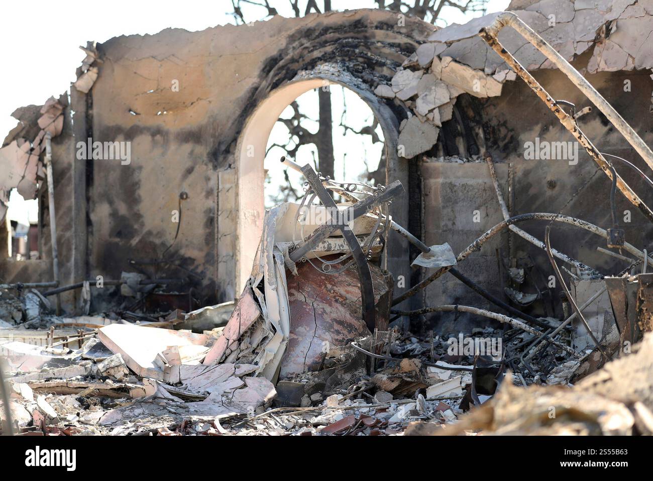 A bent cross amidst the rubble after the Altadena Community Church was ...