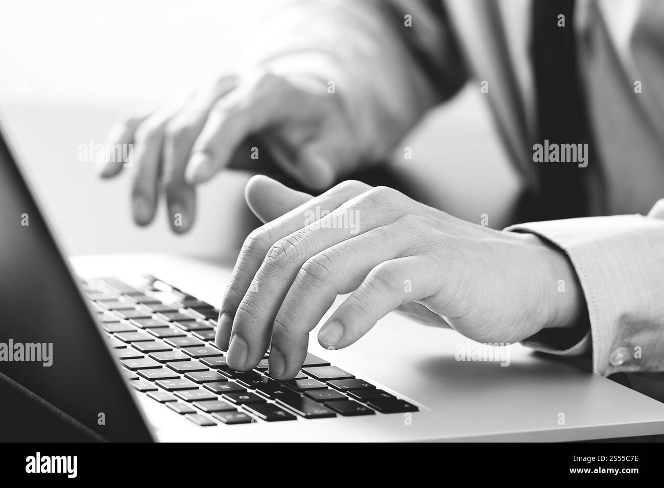 close up of businessman typing keyboard with laptop computer on wooden ...