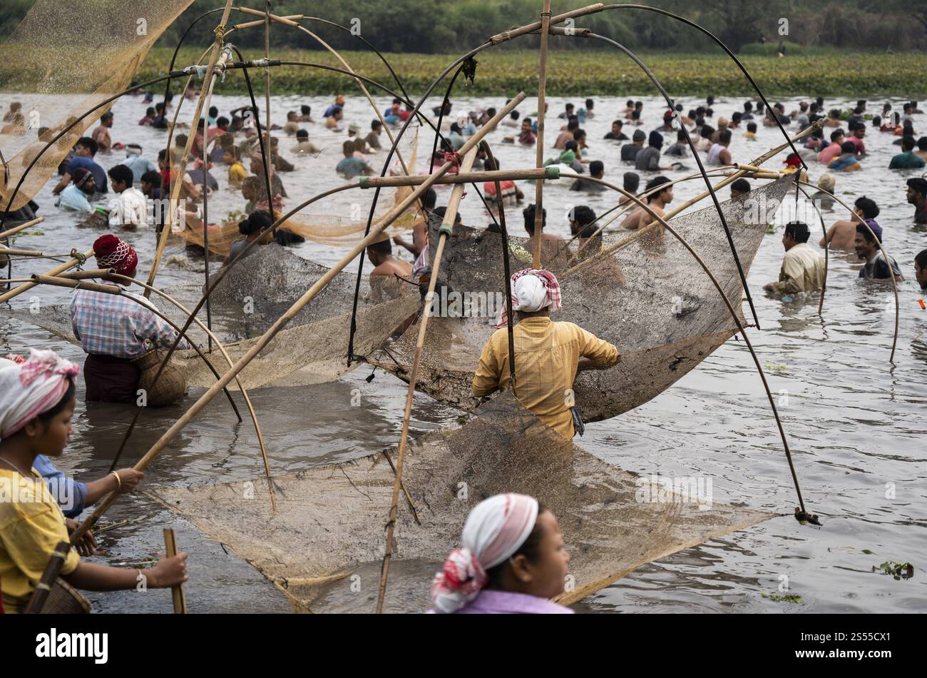 Villagers participate in a community fishing event on the occasion of ...