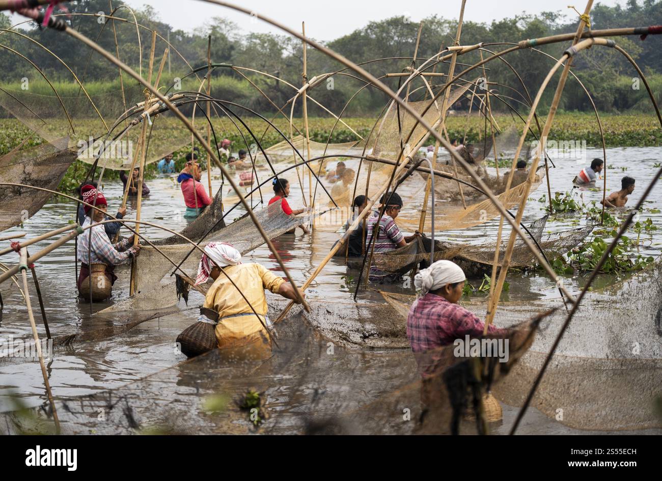 Villagers participate in a community fishing event on the occasion of ...